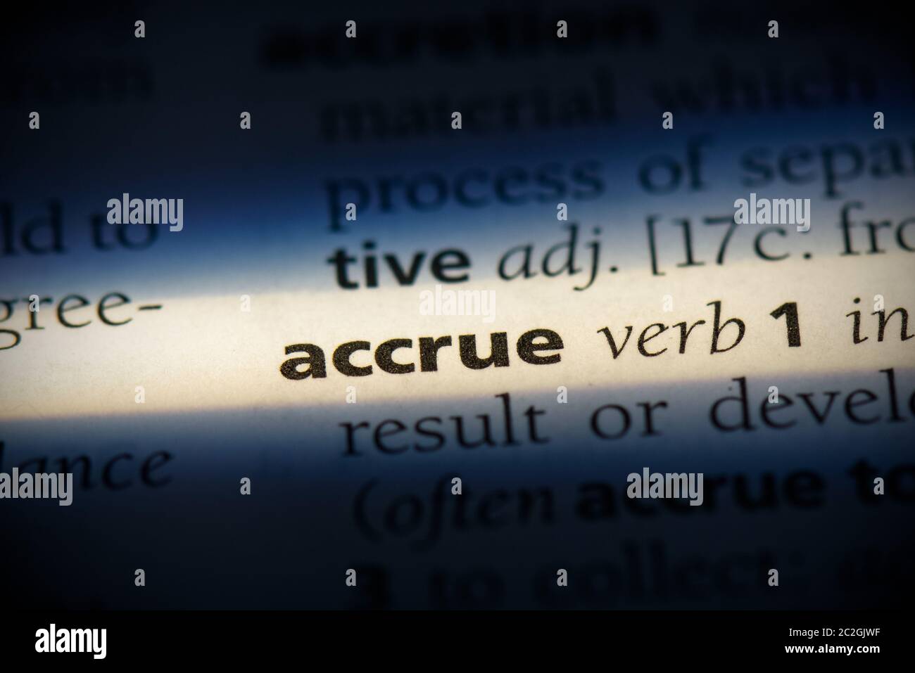 accrue word in a dictionary. accrue concept, definition Stock Photo - Alamy