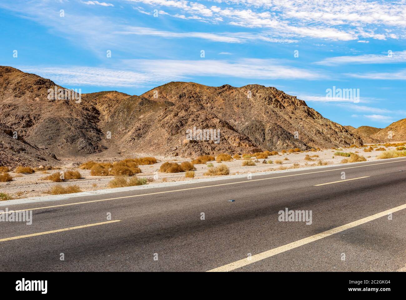 Asphalted road through mountains in egyptian desert Stock Photo - Alamy