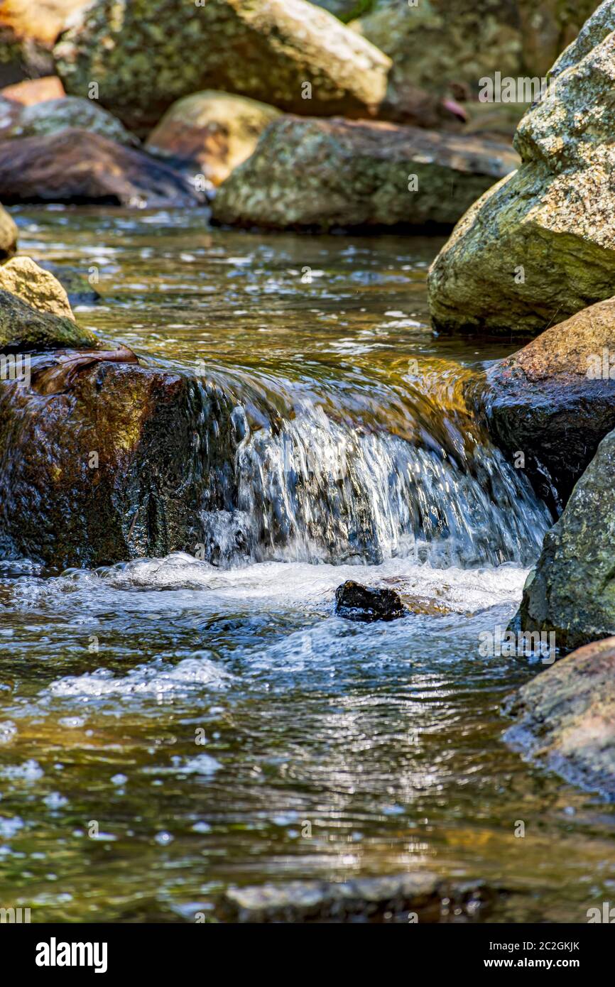 Stream flowing through rocks outdoors hi-res stock photography and ...