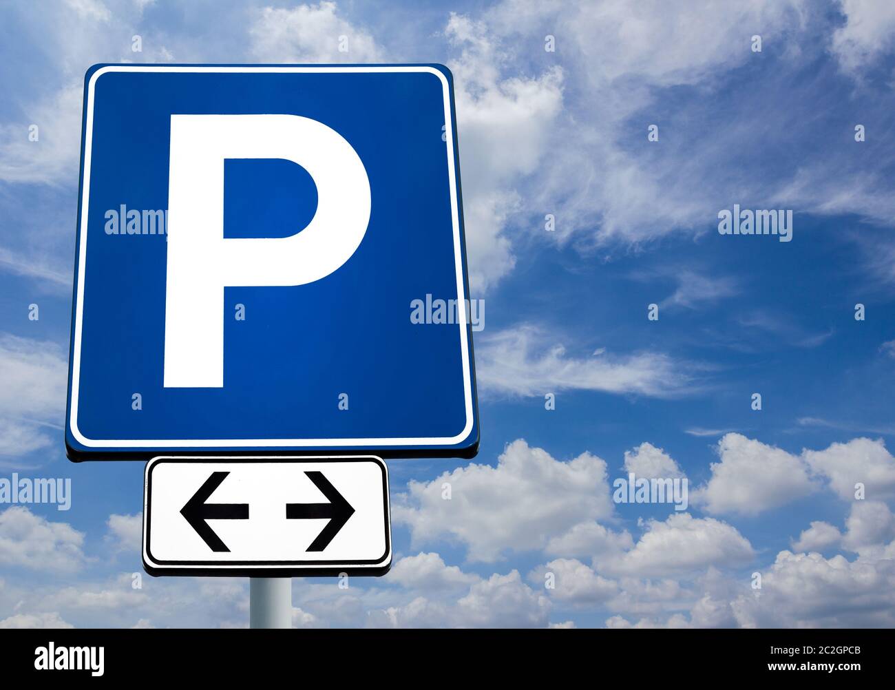 Parking signal with clouds and sky on background Stock Photo - Alamy
