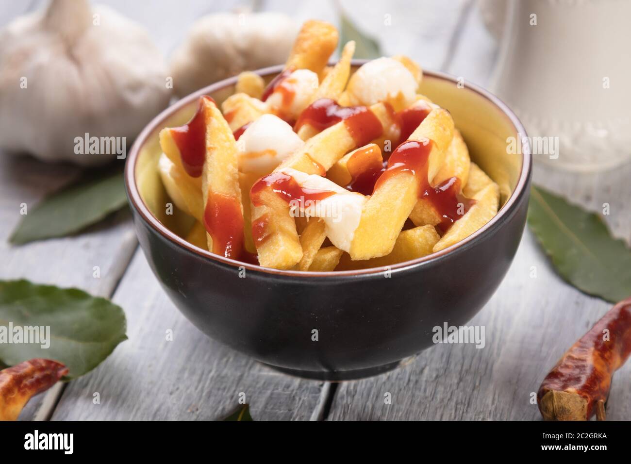 Canadian poutine, fried potato chips with cheese and gravy or sauce ...