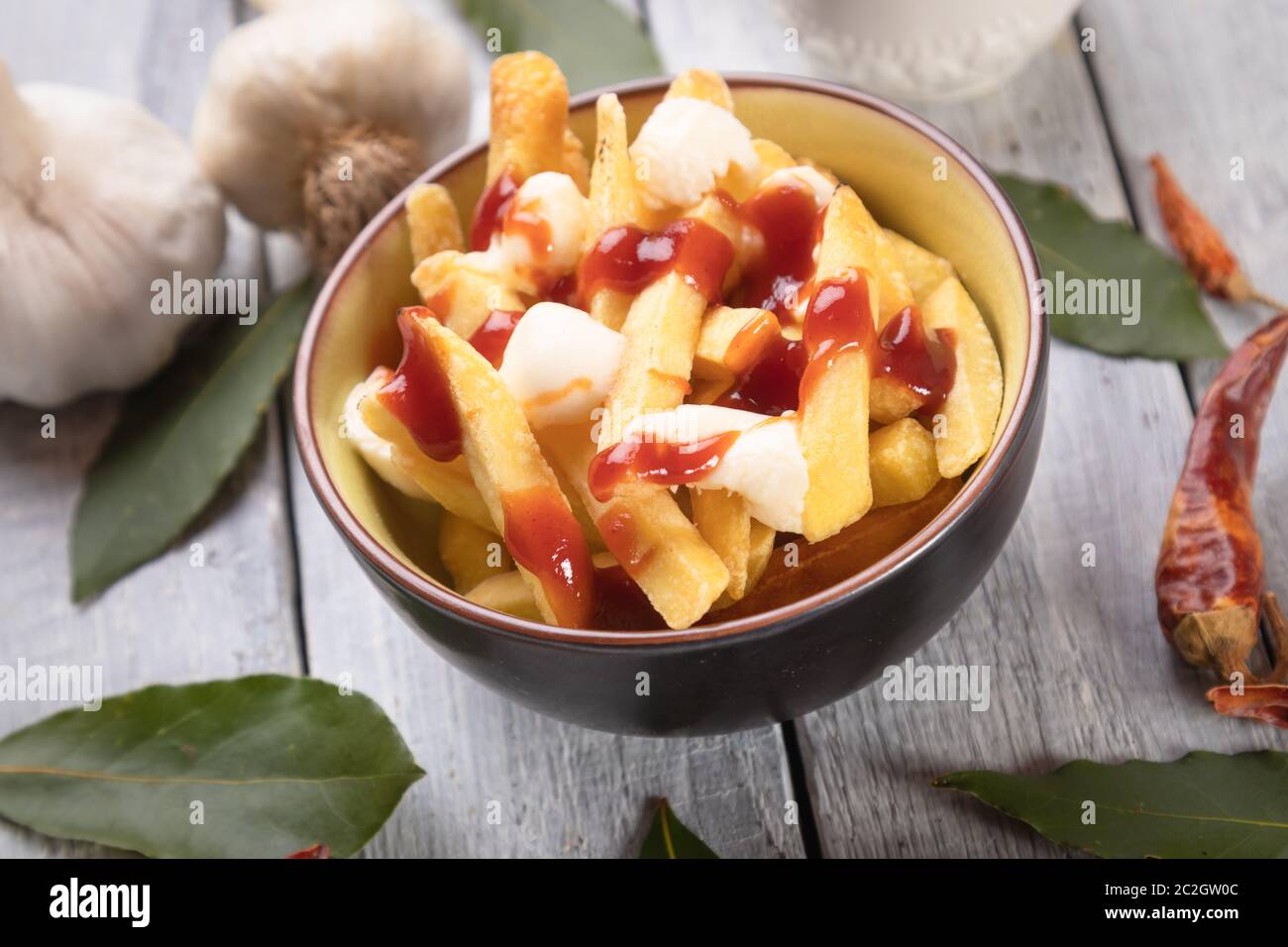 Canadian poutine, fried potato chips with cheese and gravy or sauce ...