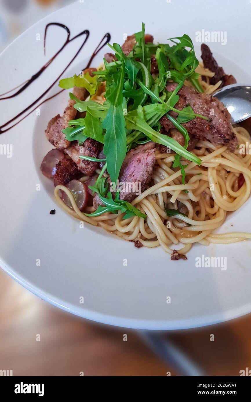 Gourmet tagliatelle with beef fillet stripes Stock Photo - Alamy