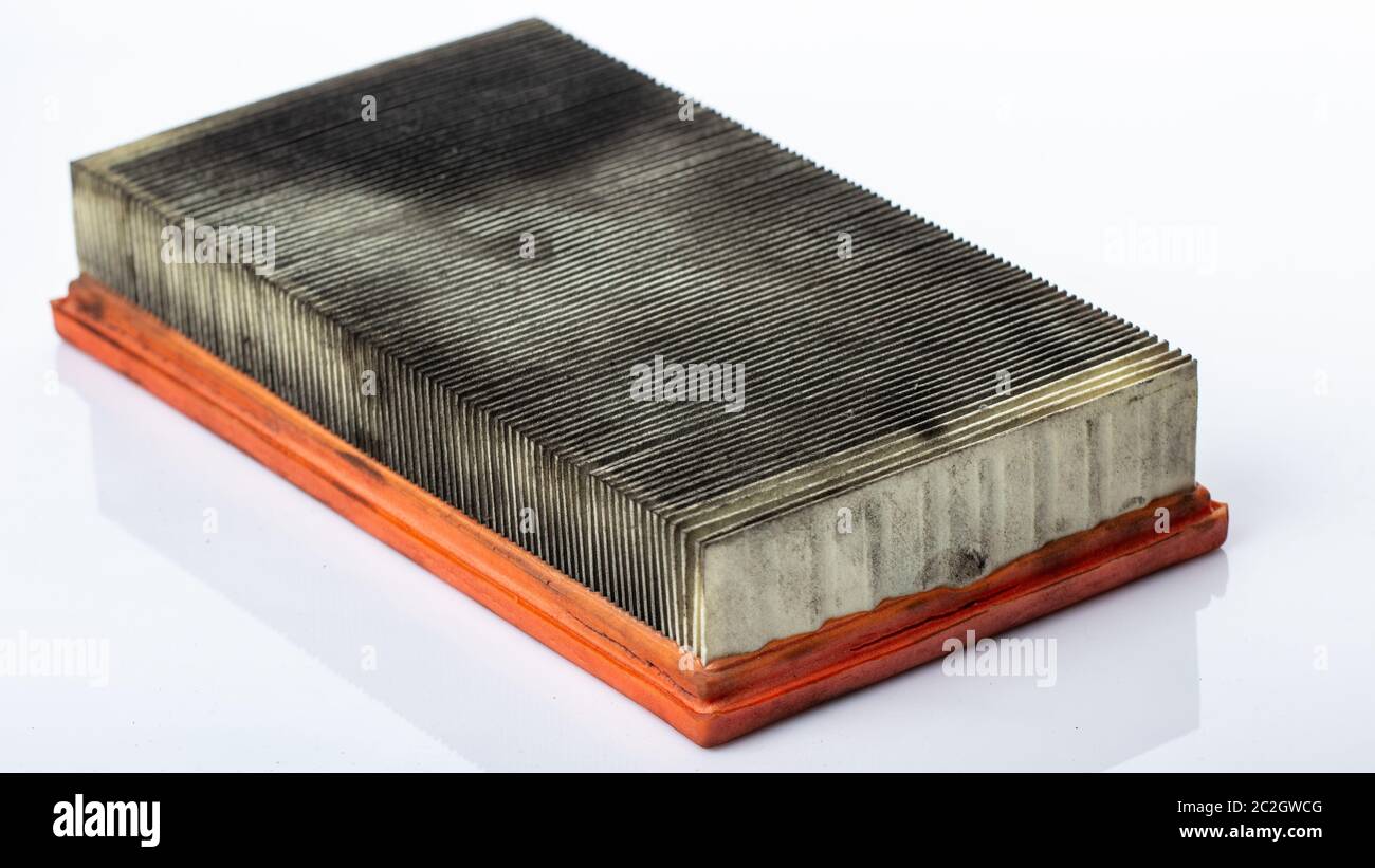 dirty car air filter, on a white background, expendable Stock Photo - Alamy