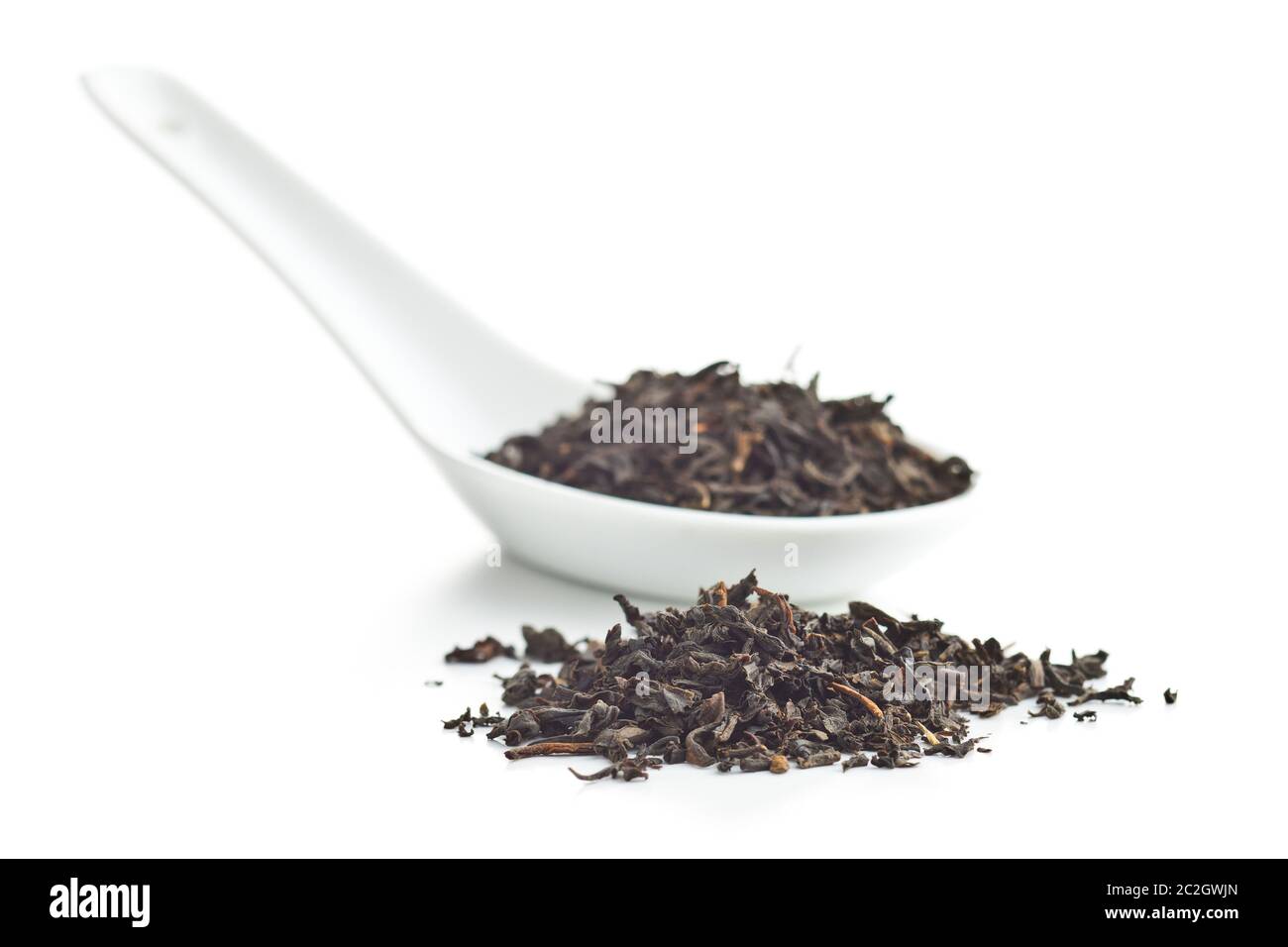 Dried black tea leaves isolated on white background Stock Photo - Alamy
