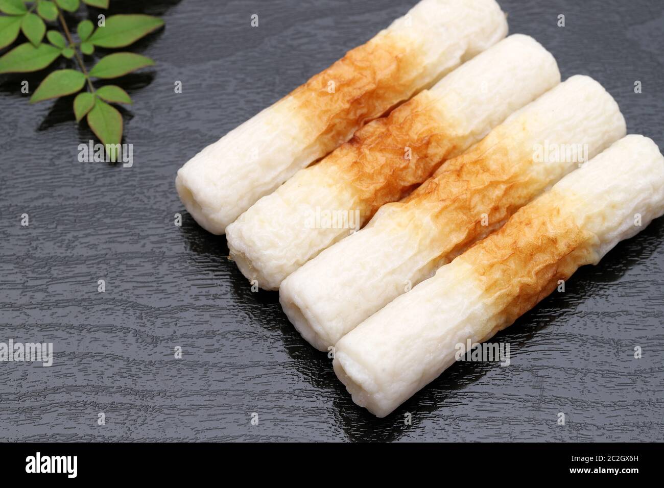 Japanese food, Chikuwa kamaboko on black background Stock Photo - Alamy