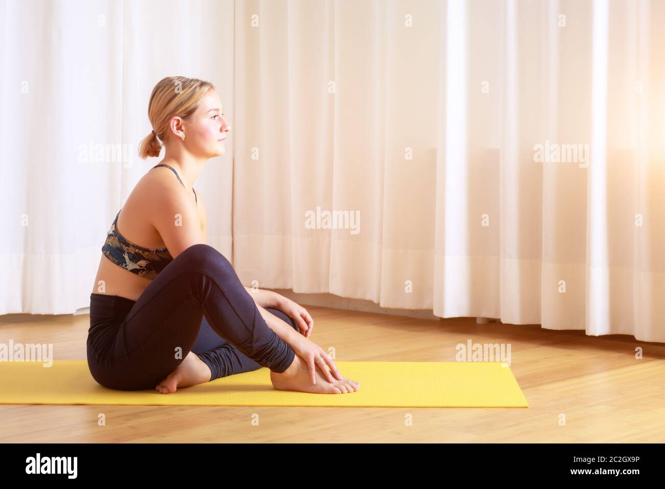 Woman doing yoga workout hi-res stock photography and images - Alamy