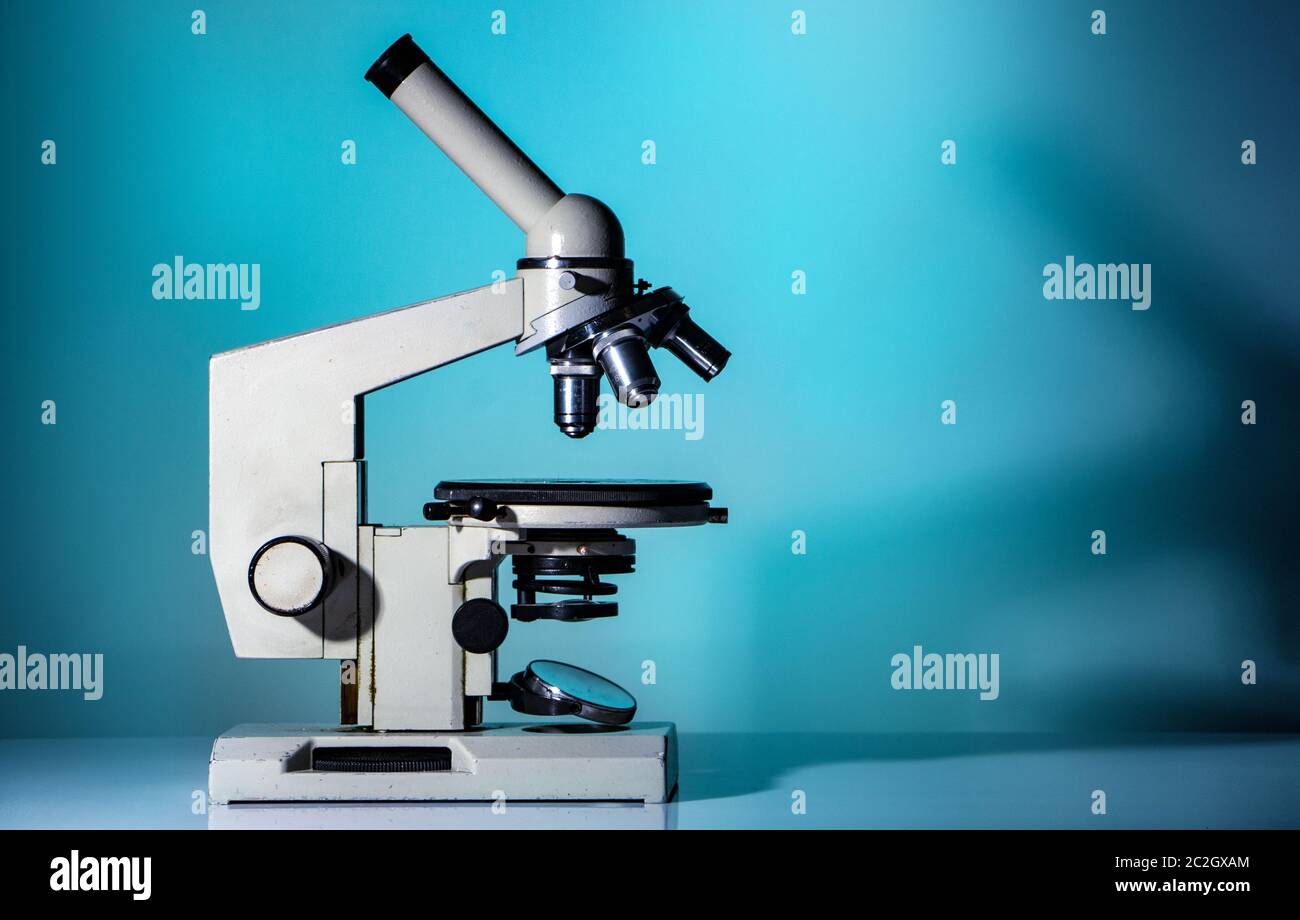 microscope lenses close up on green background Stock Photo - Alamy
