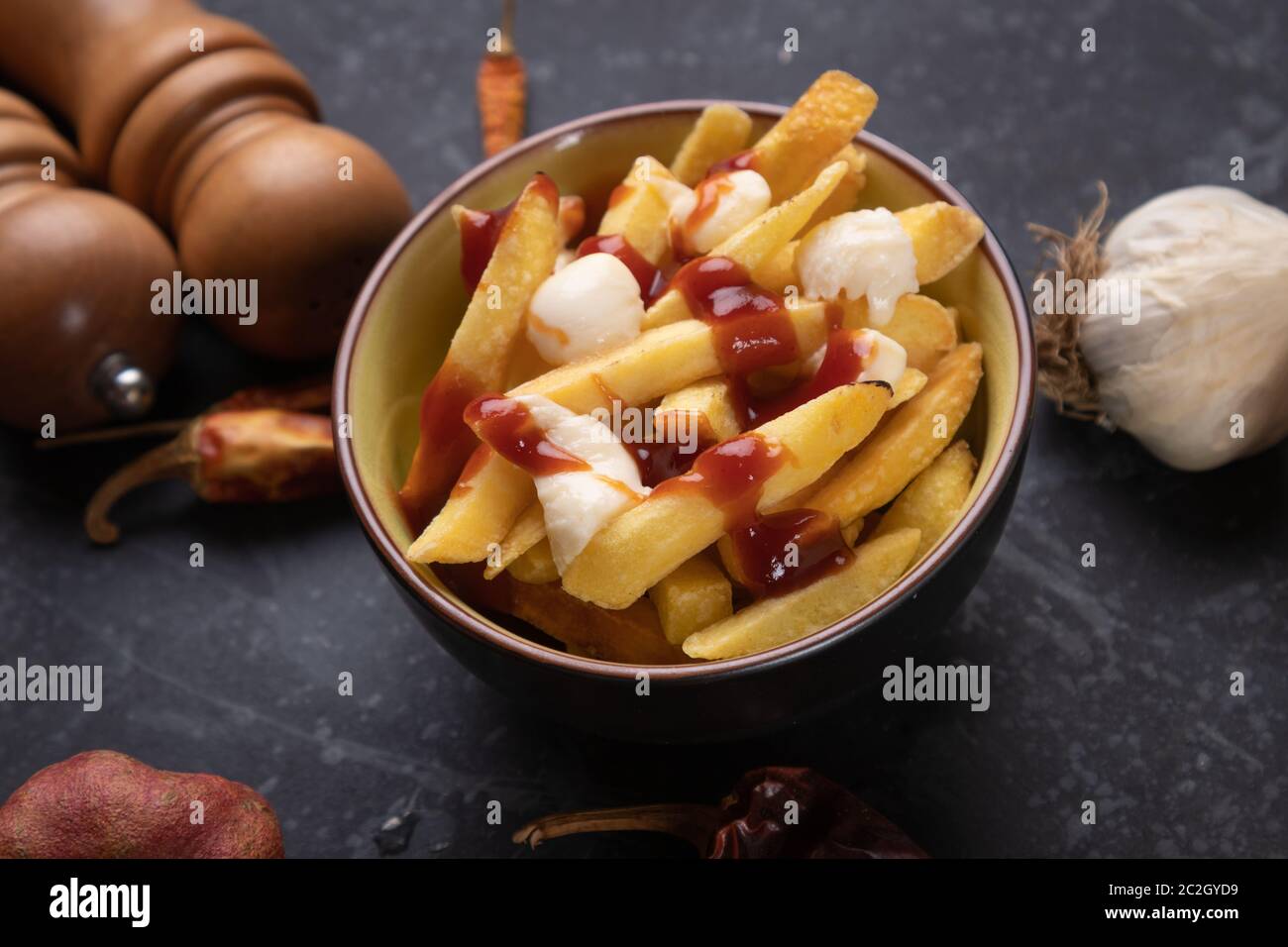 Canadian poutine, fried potato chips with cheese and gravy or sauce ...