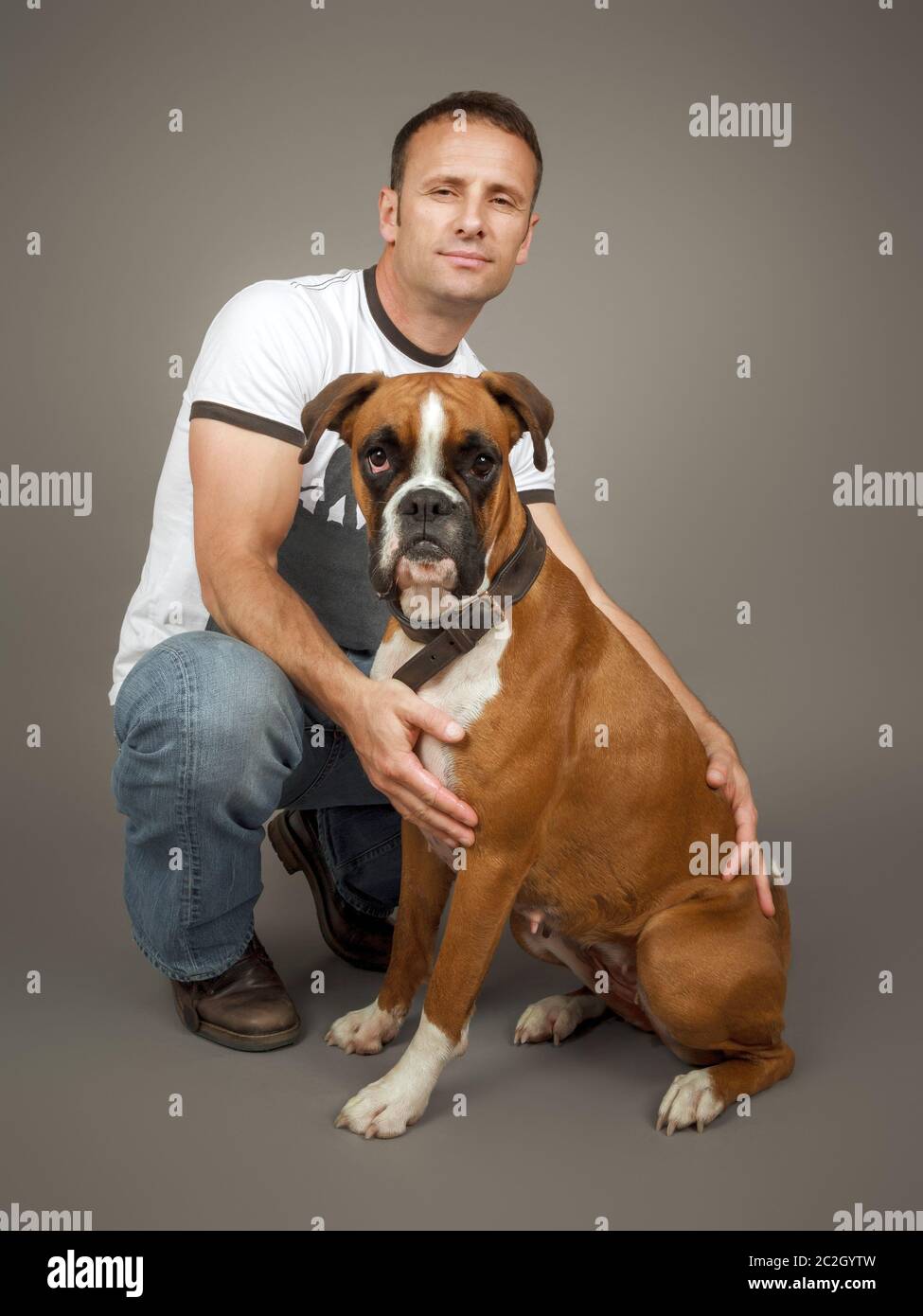handsome muscle man with his dog Stock Photo - Alamy