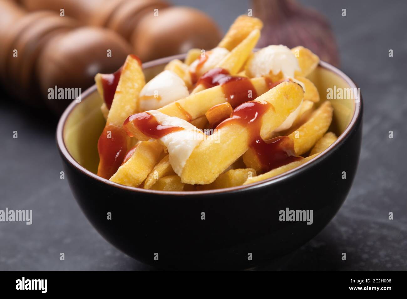 Canadian poutine, fried potato chips with cheese and gravy or sauce ...