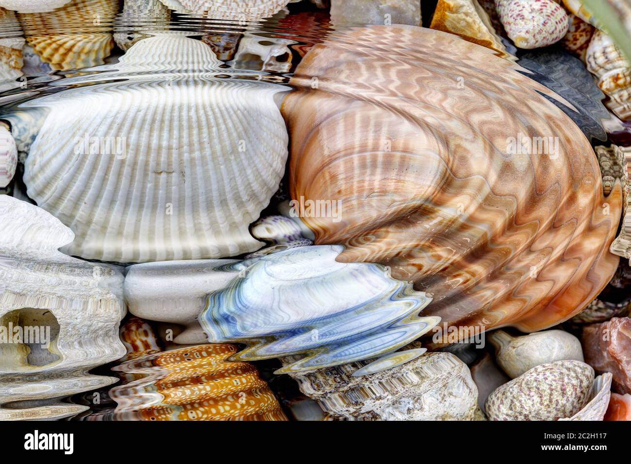 Abstract image of the water ripples over the stone pebbles - digitally ...