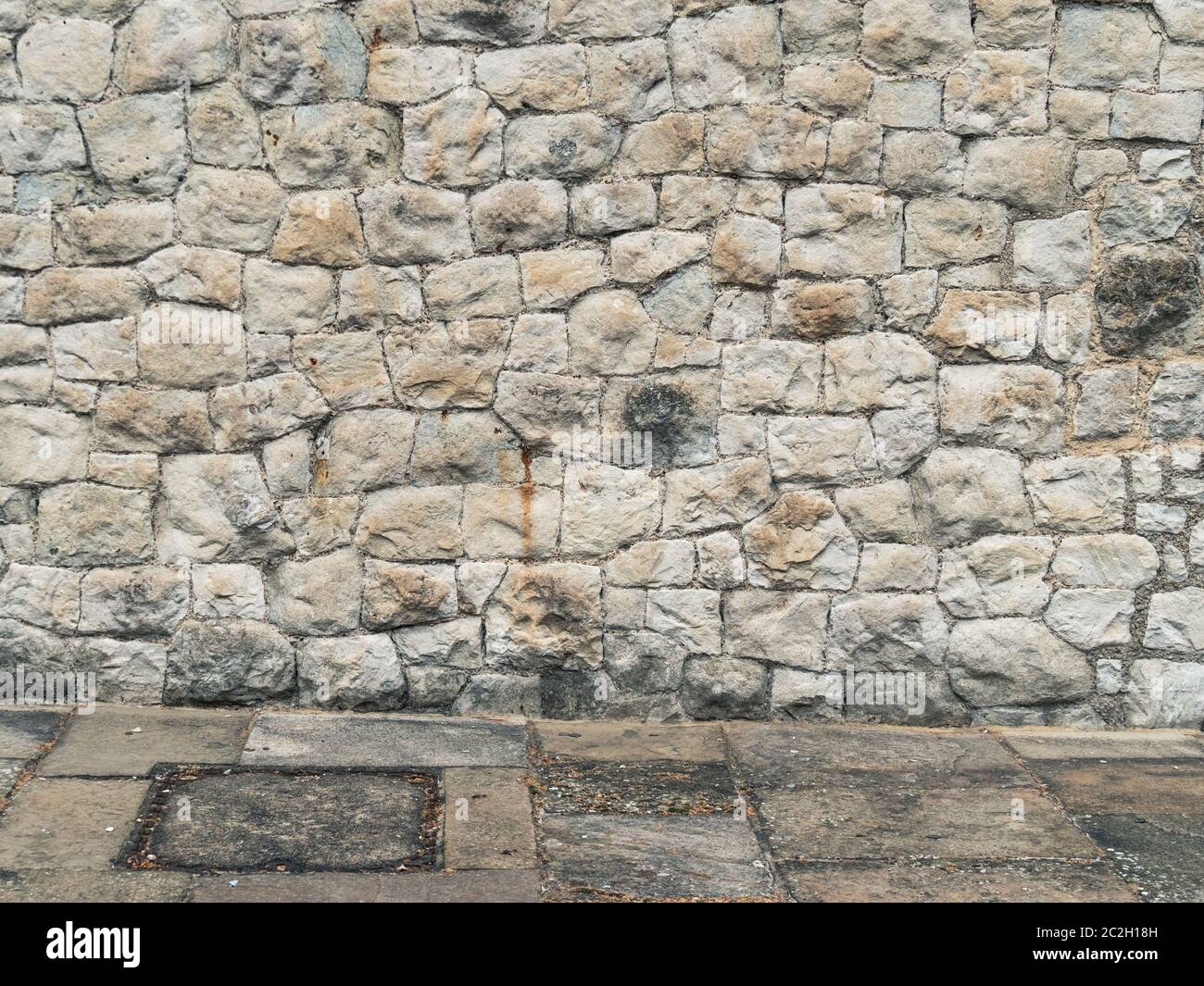 Abstract empty urban exterior background with cobble wall and concrete ...