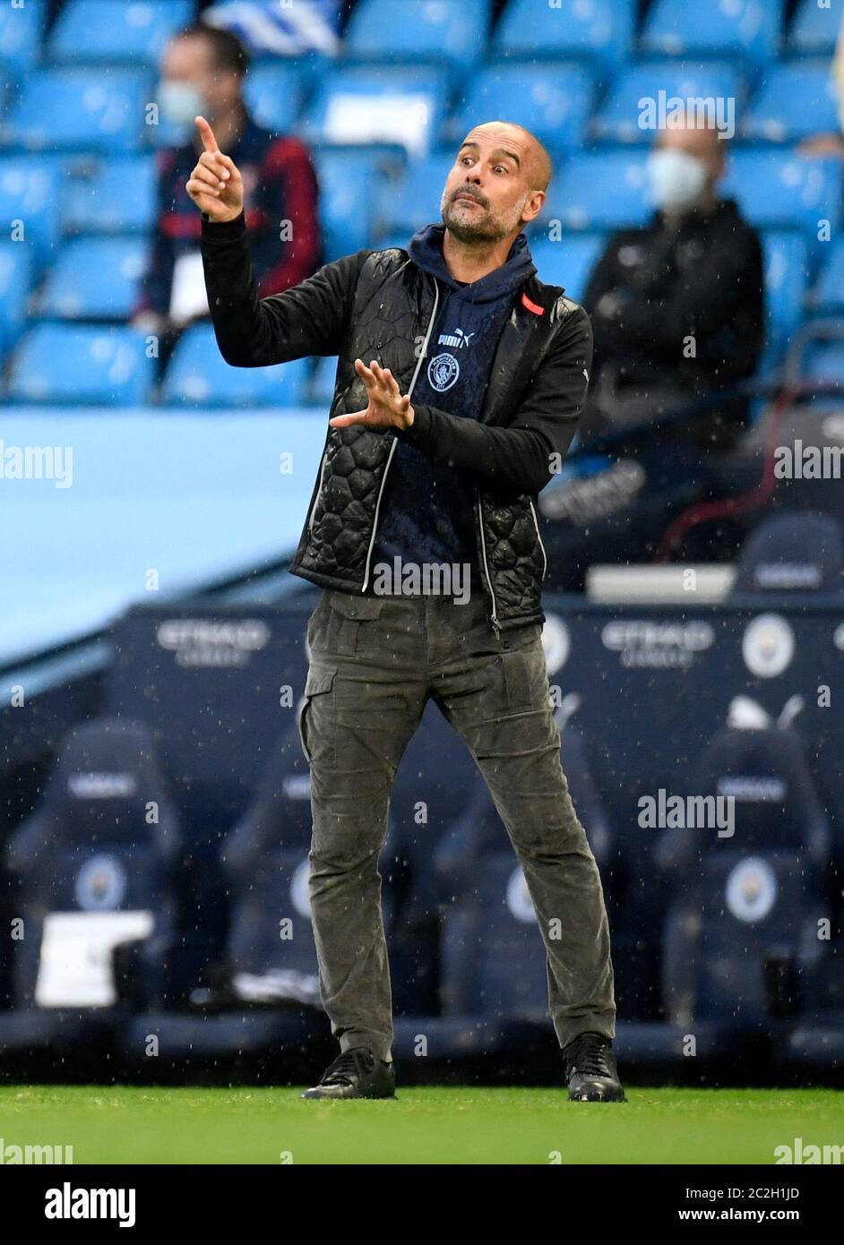 Manchester City manager Pep Guardiola gestures on the touchline during ...