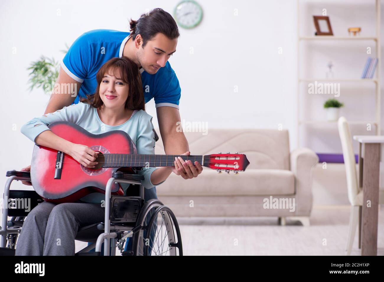 Disabled wife and husband at home Stock Photo - Alamy