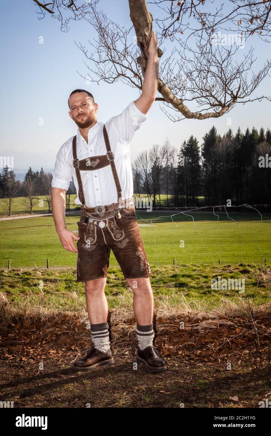 bavarian tradition man in the grass Stock Photo - Alamy