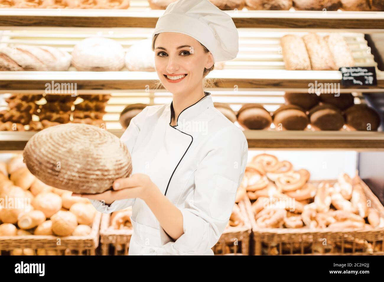 Woman offering bread hi-res stock photography and images - Alamy