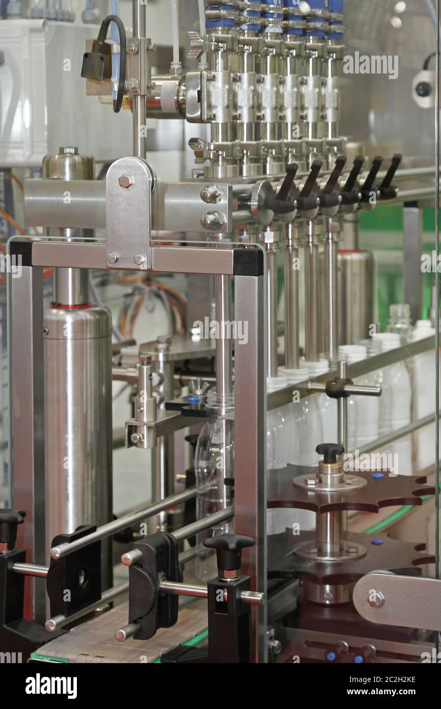 Automated Bottle Filling Machine Production Line in Factory Stock Photo ...