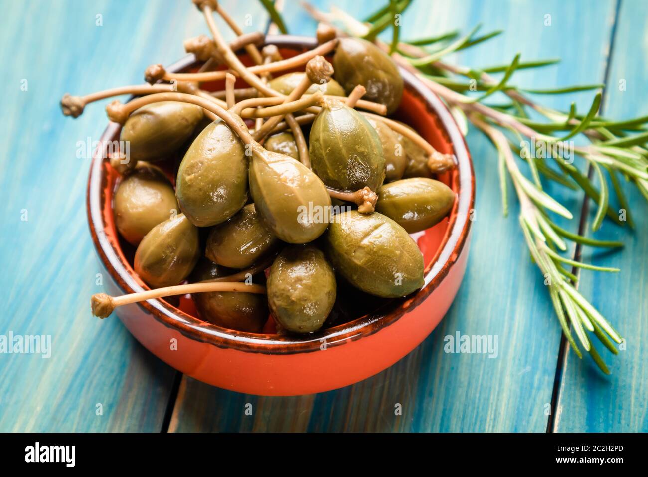 Pickled or marinated green capers close-up, selective focus Stock Photo ...