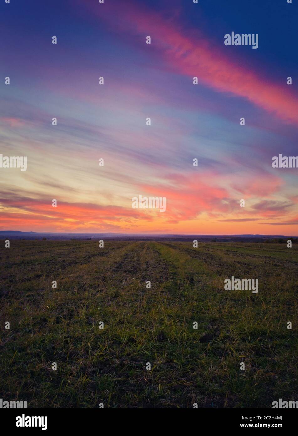 Majestic autumn sunset over a countryside open field. Soft and colorful ...