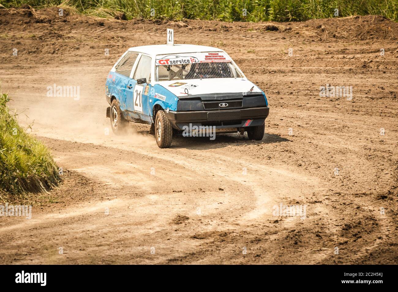 Traditional rally .The racing car drives into a steep turn, scattering ...