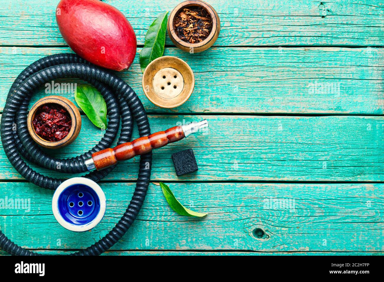 Smoking hookah.Details of oriental shisha.Shisha with mango flavor of ...