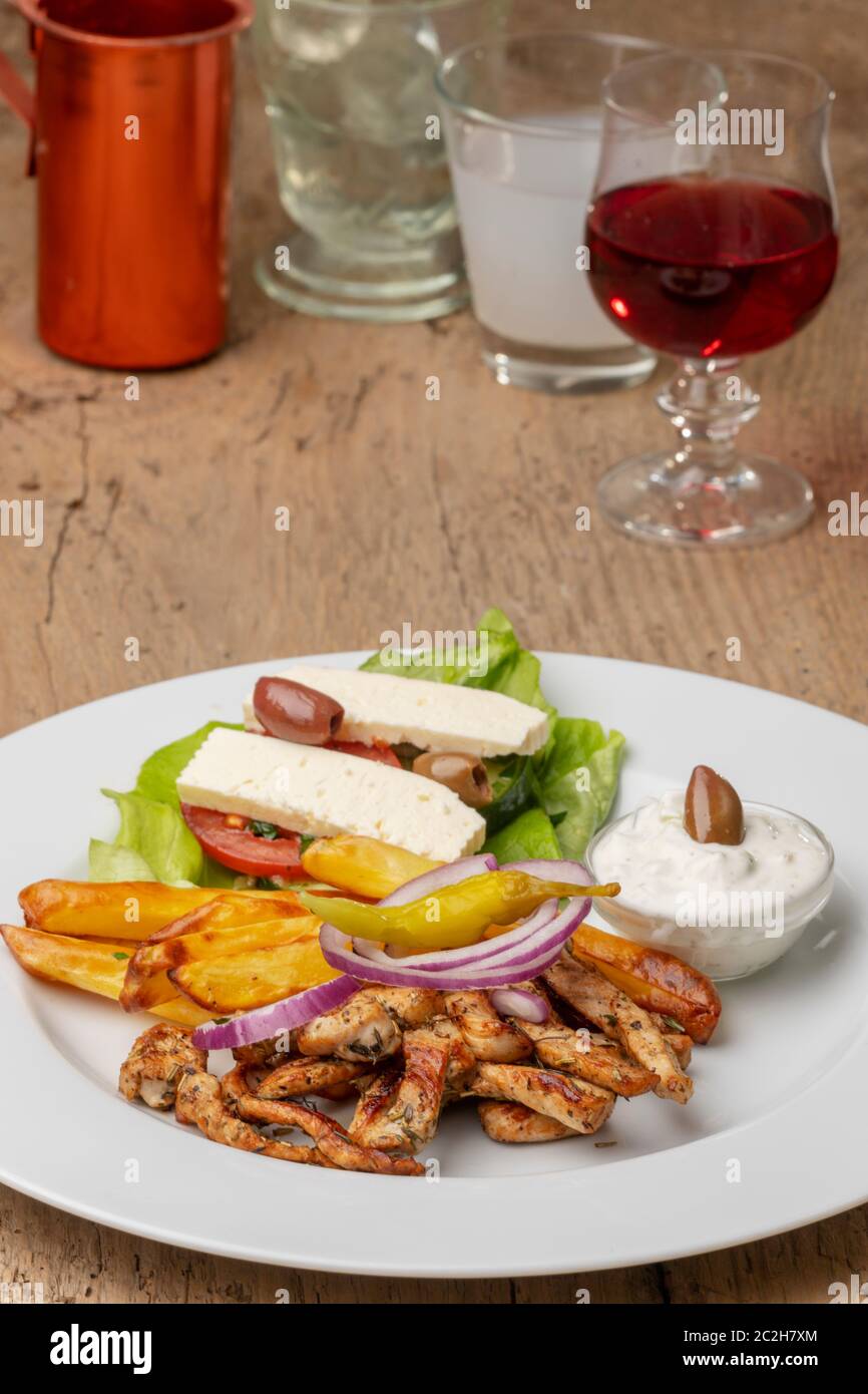 greek gyros on a plate with fries Stock Photo - Alamy