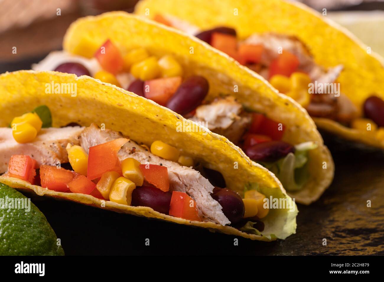 three mexican tacos on slate Stock Photo - Alamy