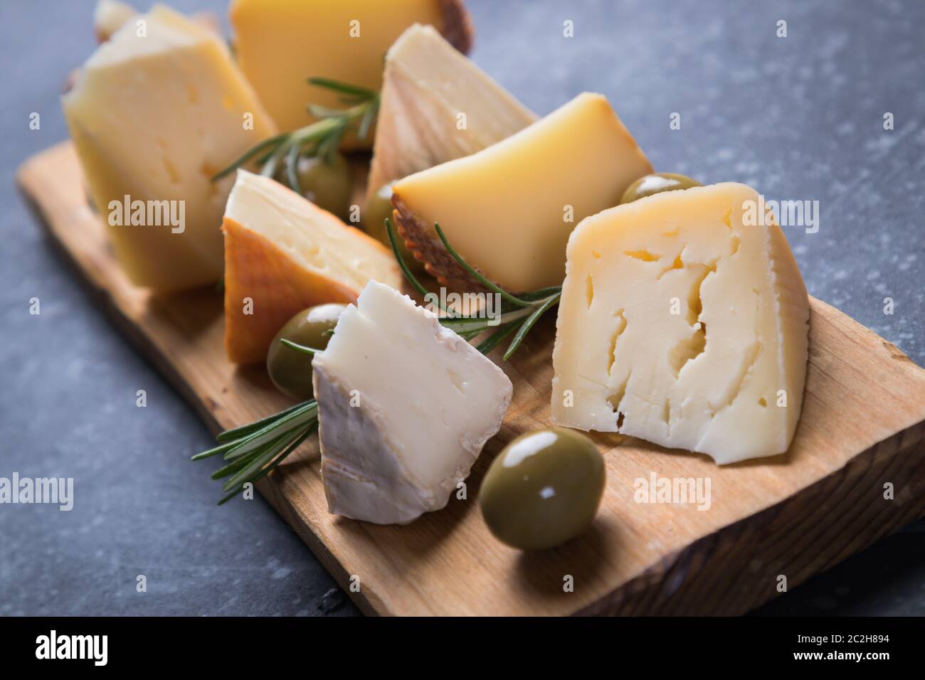 Cheese platter with blue, aged, yellow and white cheeses Stock Photo ...
