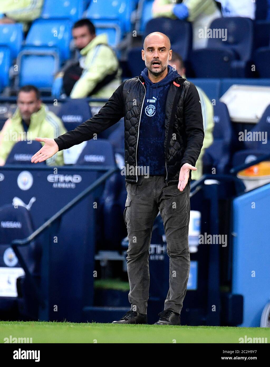 Manchester City manager Pep Guardiola gestures on the touchline during ...