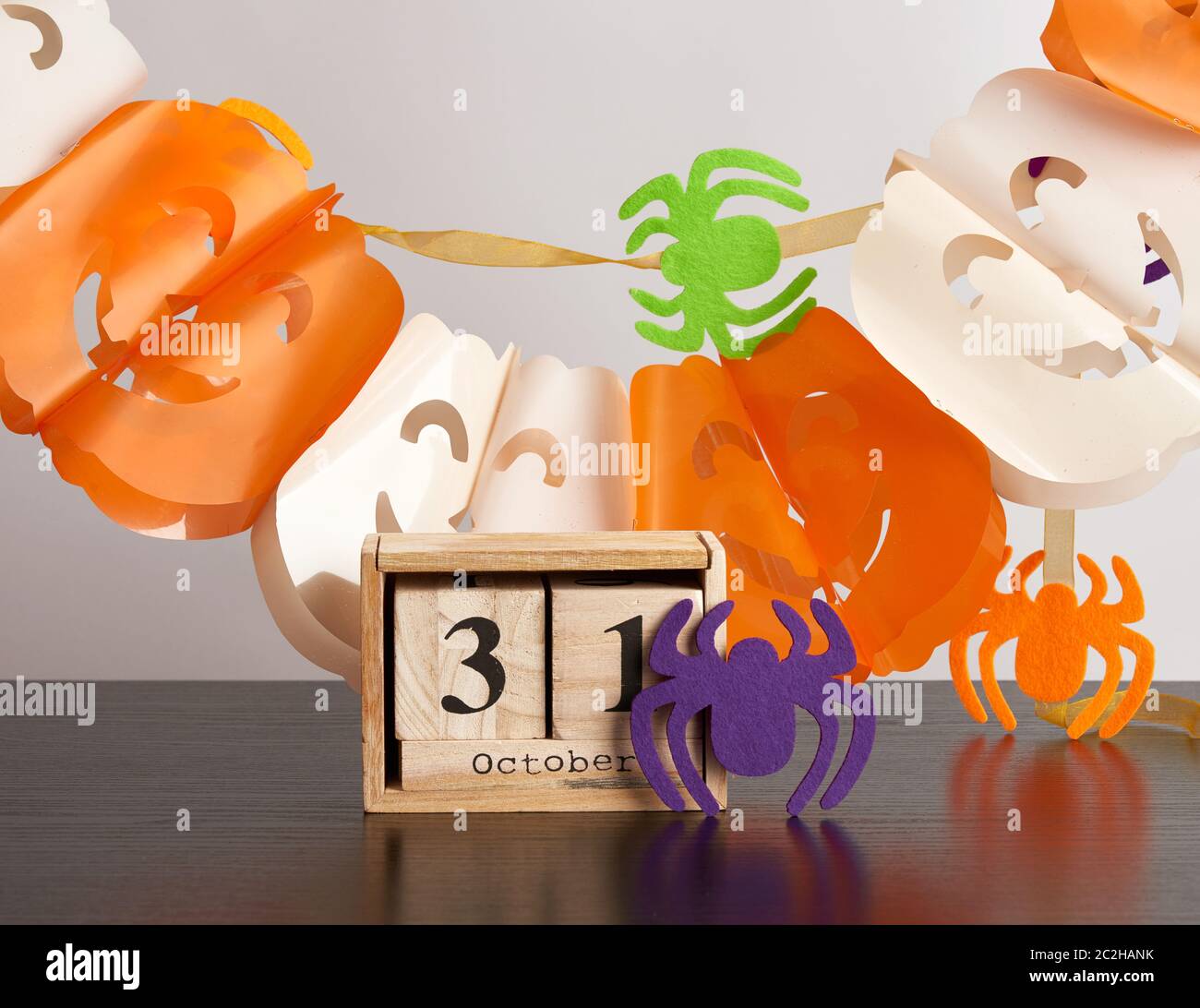 wooden calendar of cubes, garland of pumpkins and spiders, Halloween ...