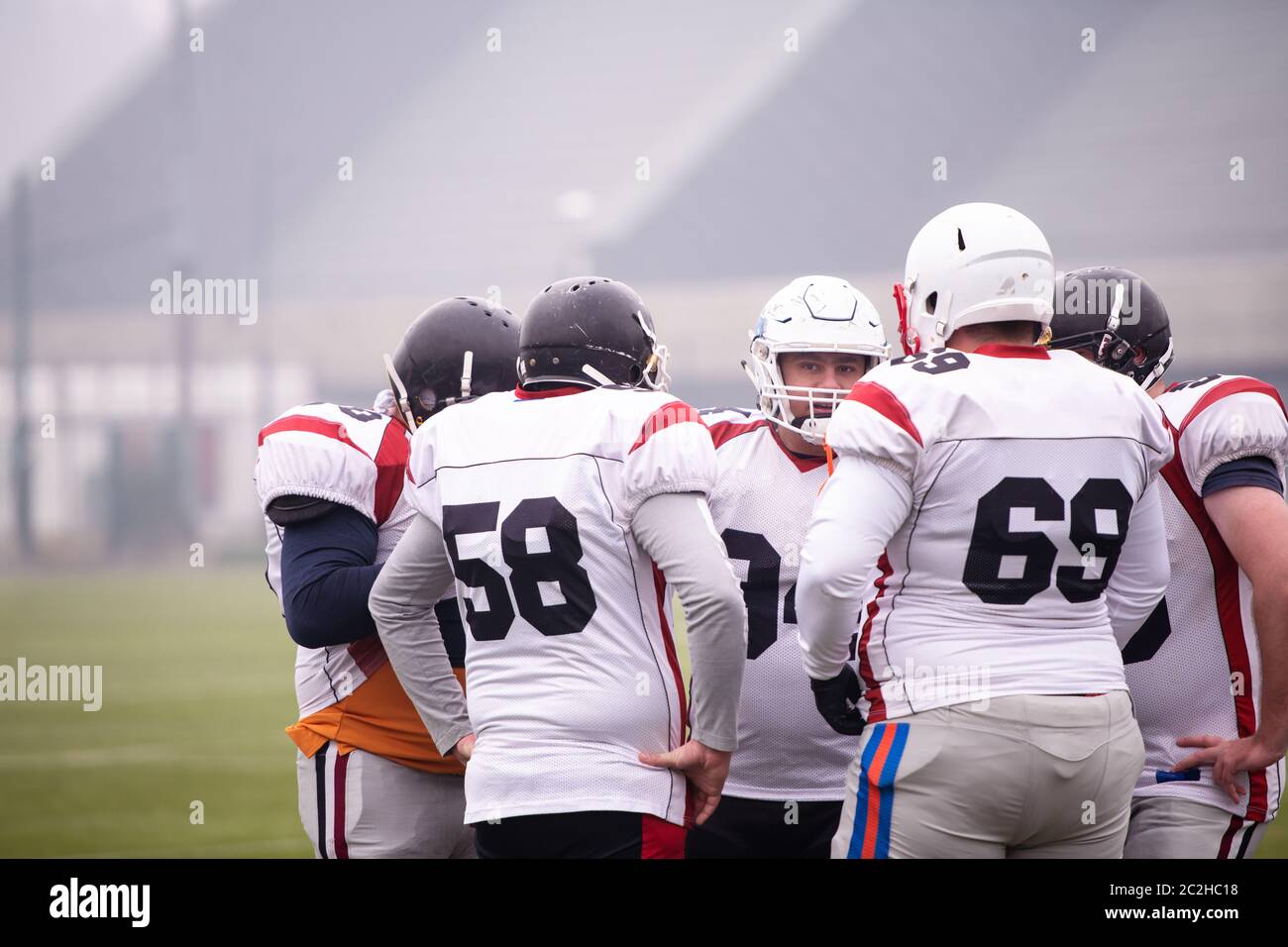 american football players discussing strategy Stock Photo - Alamy