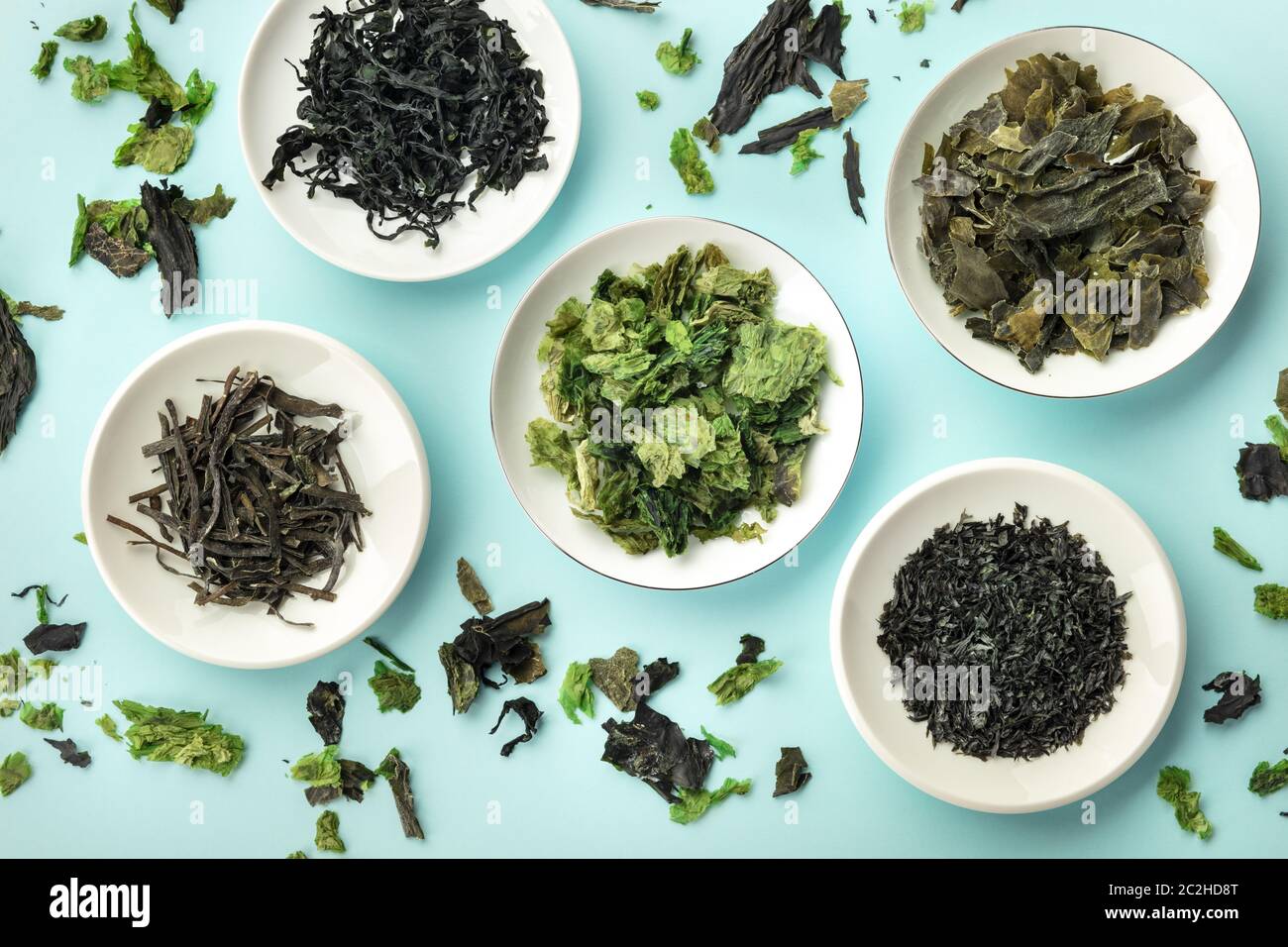 Various dry seaweed, sea vegetables, shot from above on a teal ...