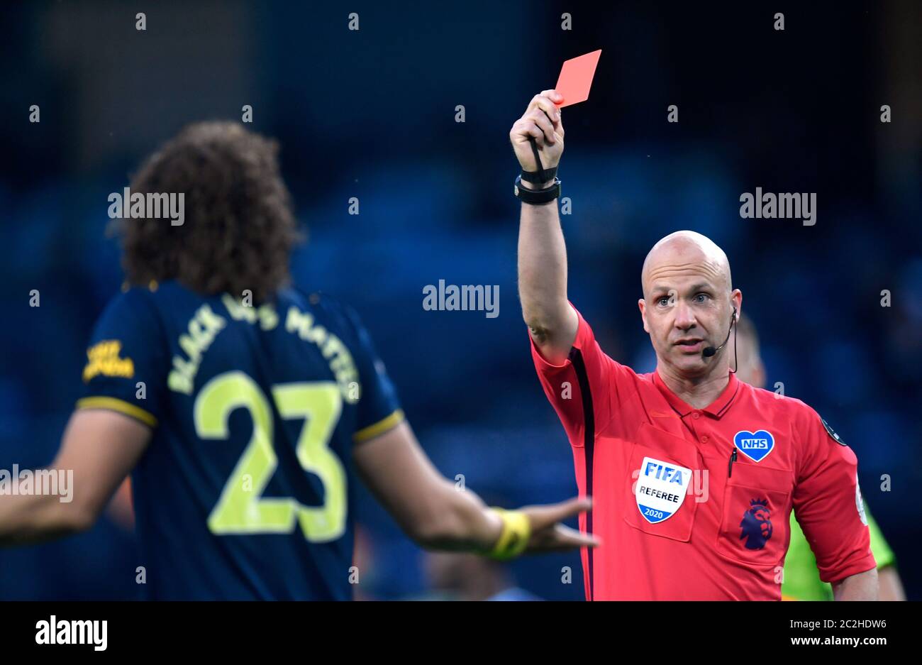 Referee Anthony Taylor shows Arsenal's David Luiz a red card after a ...