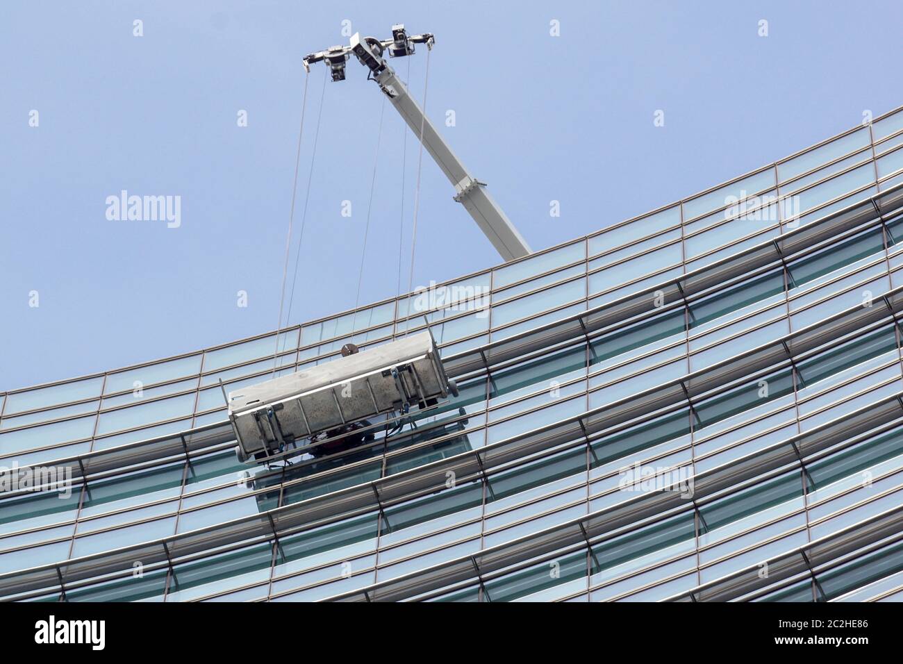 Facade cleaning elevator for big buildings Stock Photo - Alamy