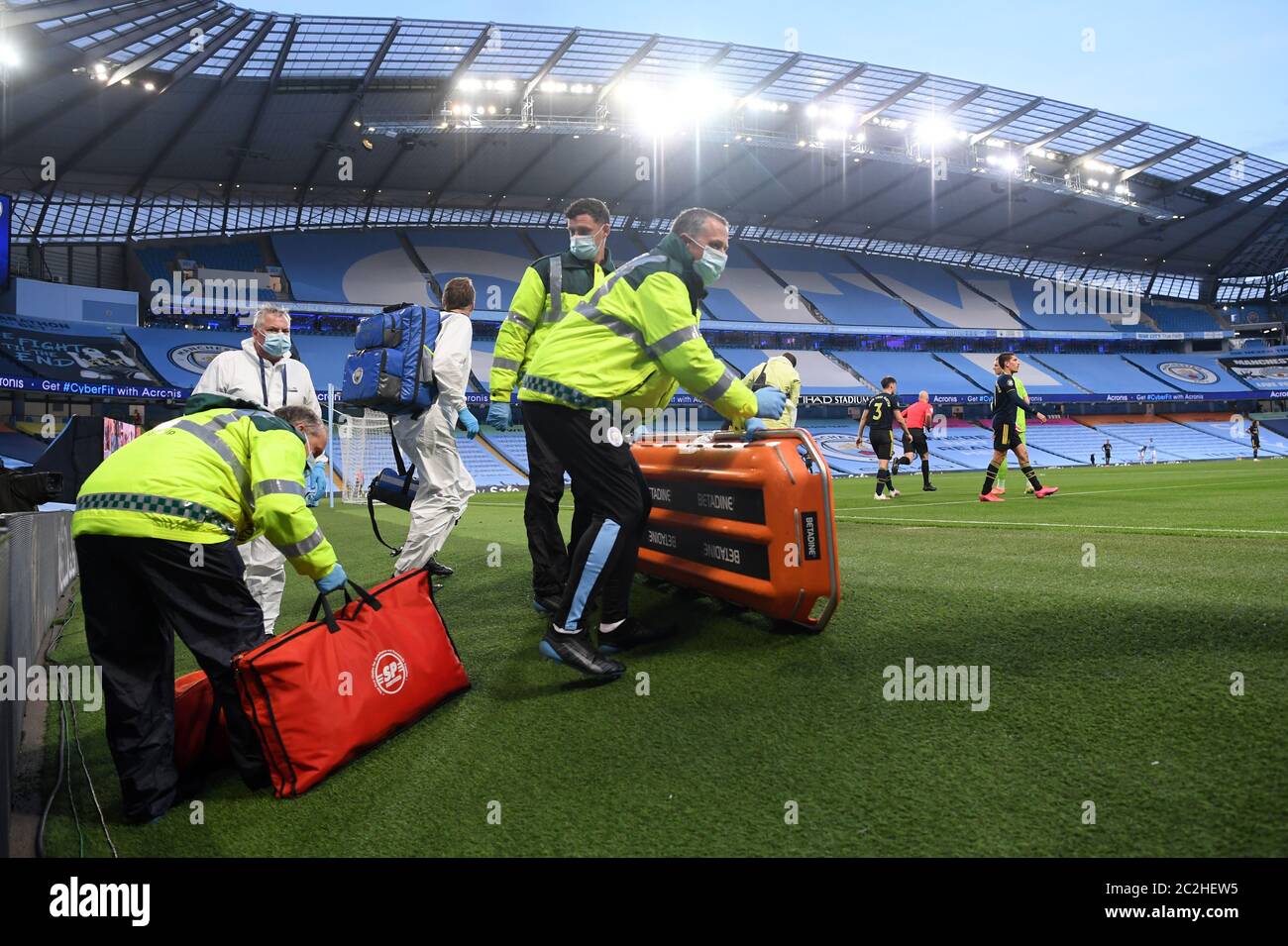 Medical staff wearing PPE during the Premier League match at the Etihad ...