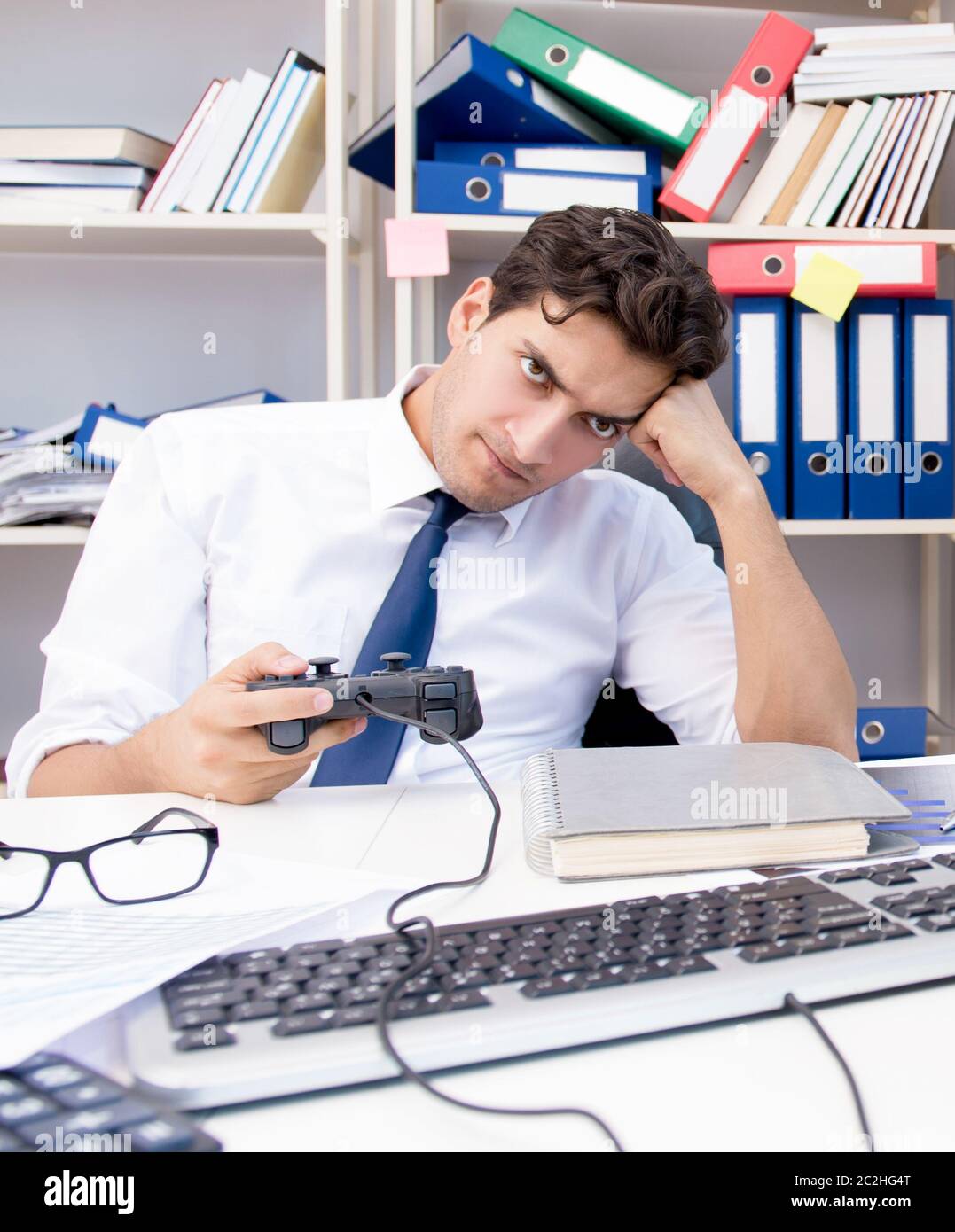 The employee playing computer games in the office Stock Photo - Alamy