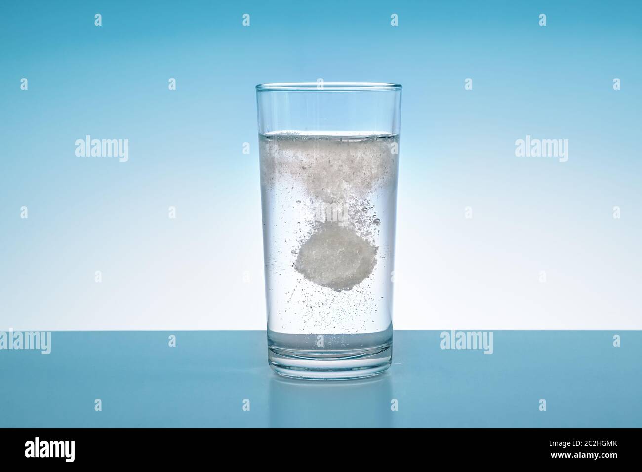 Tablet falls into a water glass Stock Photo - Alamy