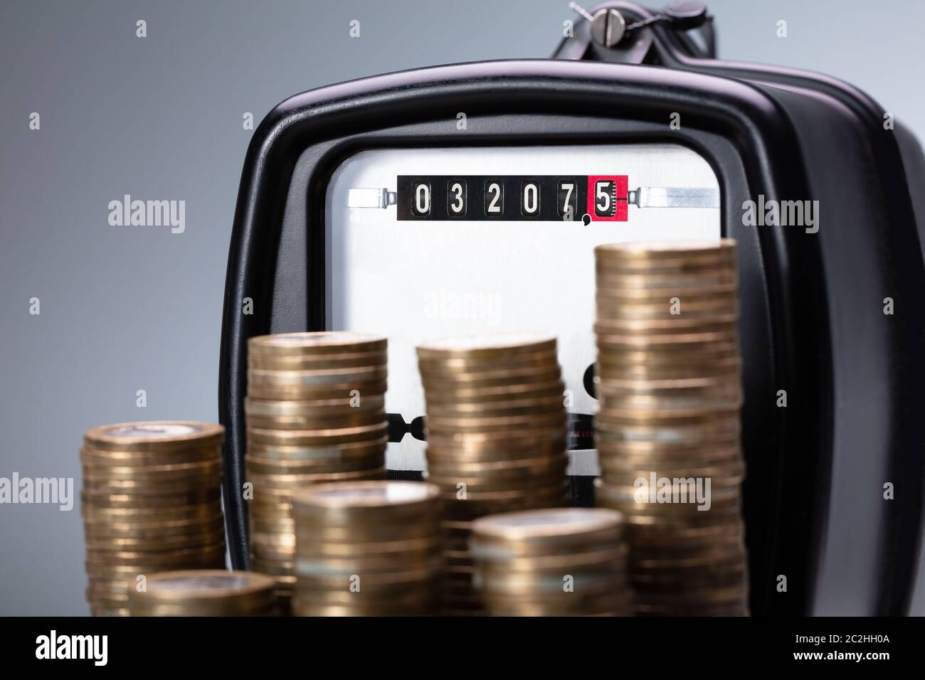 Close-up Of A Stacked Coin Measuring On Kilowatt Electricity Meter ...