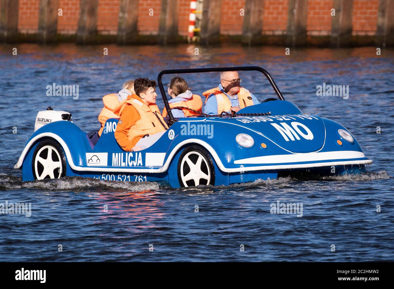 People are seen in a small motor-powered boat on May 31, 2020 in Gdansk ...