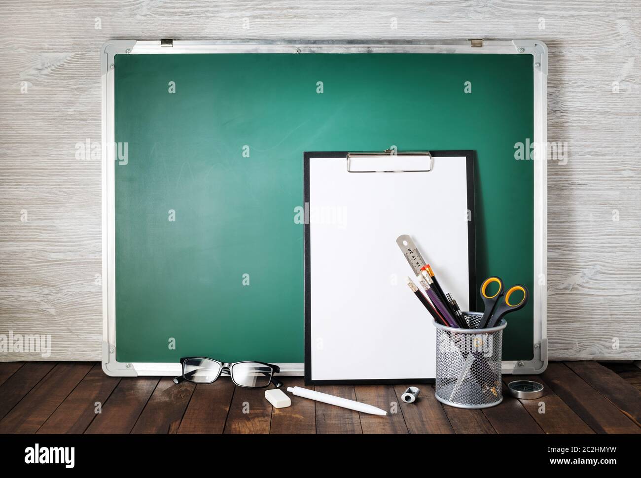 Green blackboard, stationery Stock Photo - Alamy