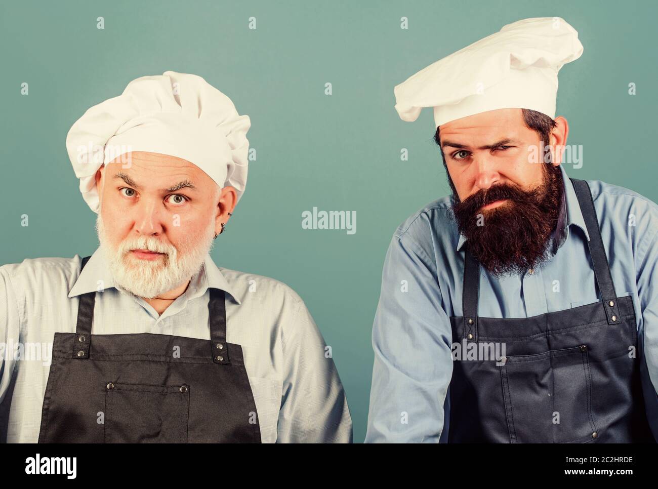 Cooking process. serious men in cook hat. mature bearded chef. tired of ...