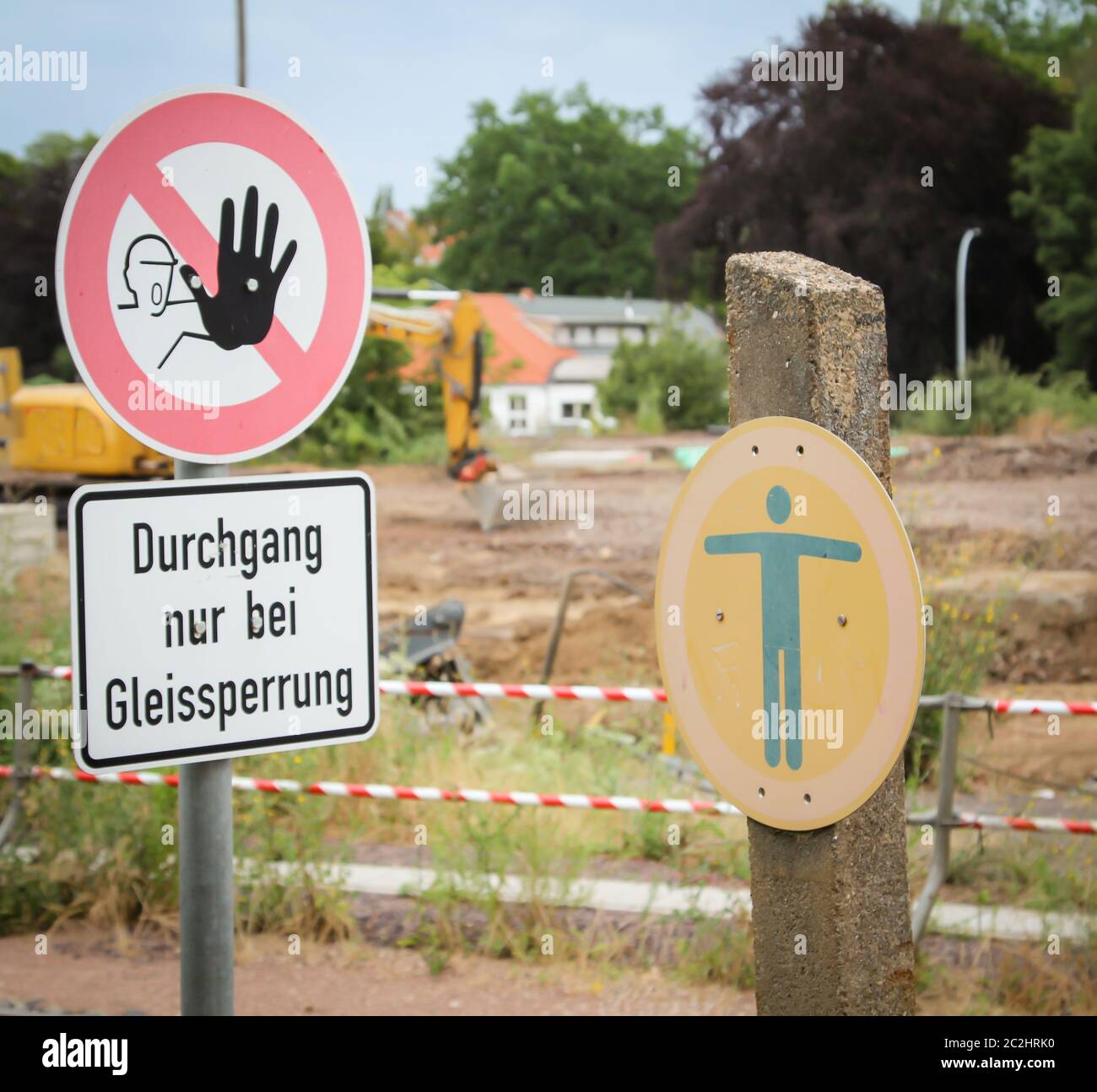 A sign indicates a ban on crossing railroad tracks Stock Photo - Alamy
