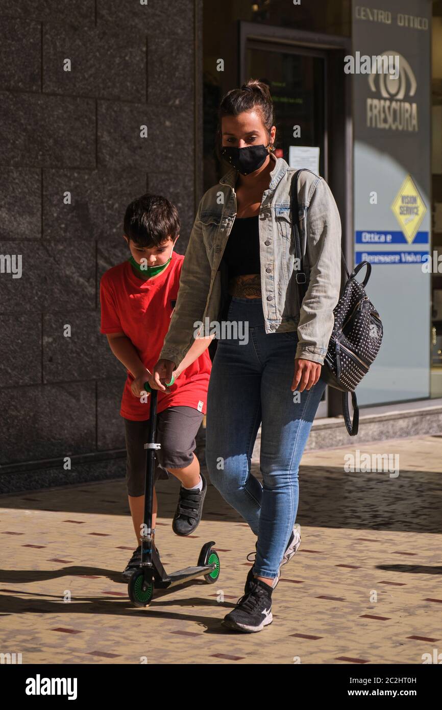 Coronavirus couple young boy and girl brother and sister walking street ...