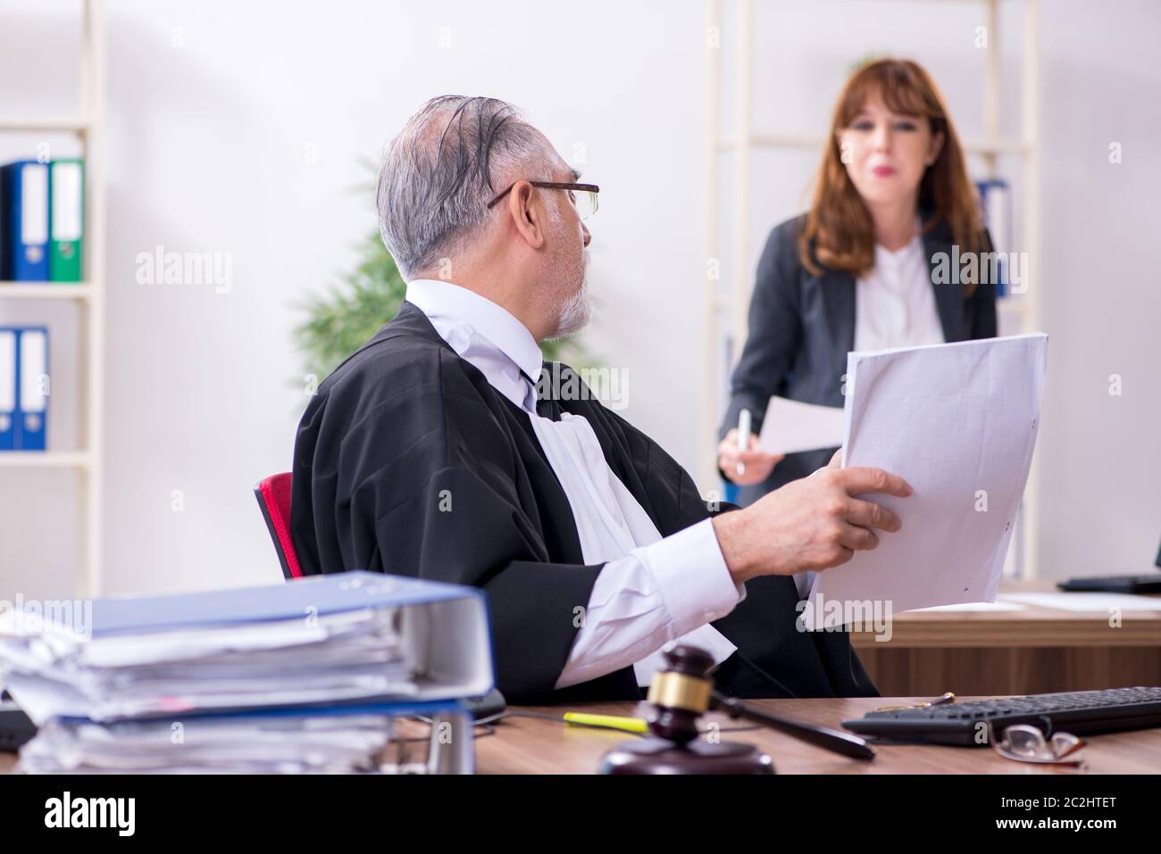 Old judge and his young secretary in the office Stock Photo - Alamy