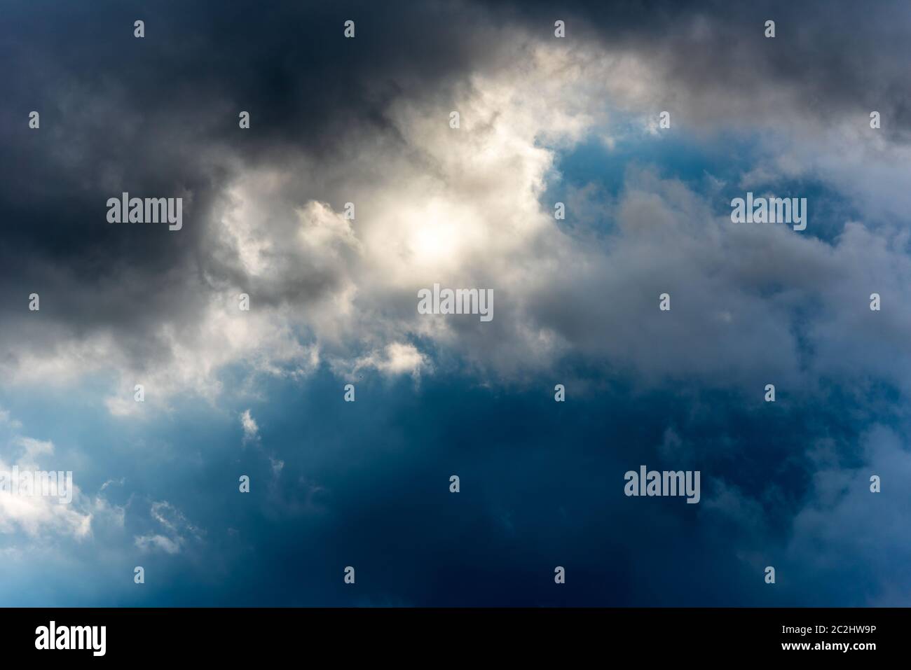 Dark clouds and sun rays. Rainy day clouds Stock Photo - Alamy