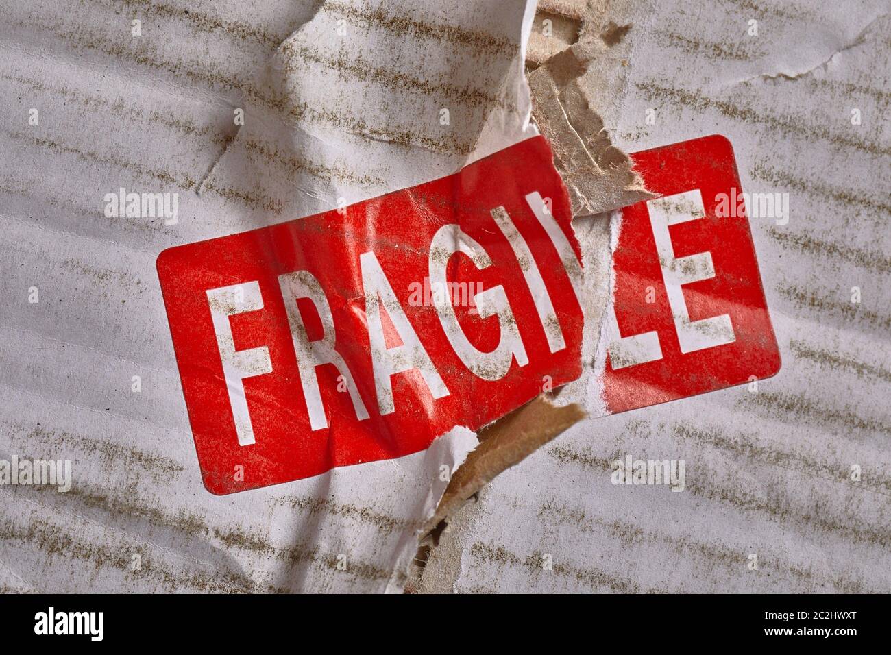 Fragile stamp on a delivery pack broken Stock Photo - Alamy
