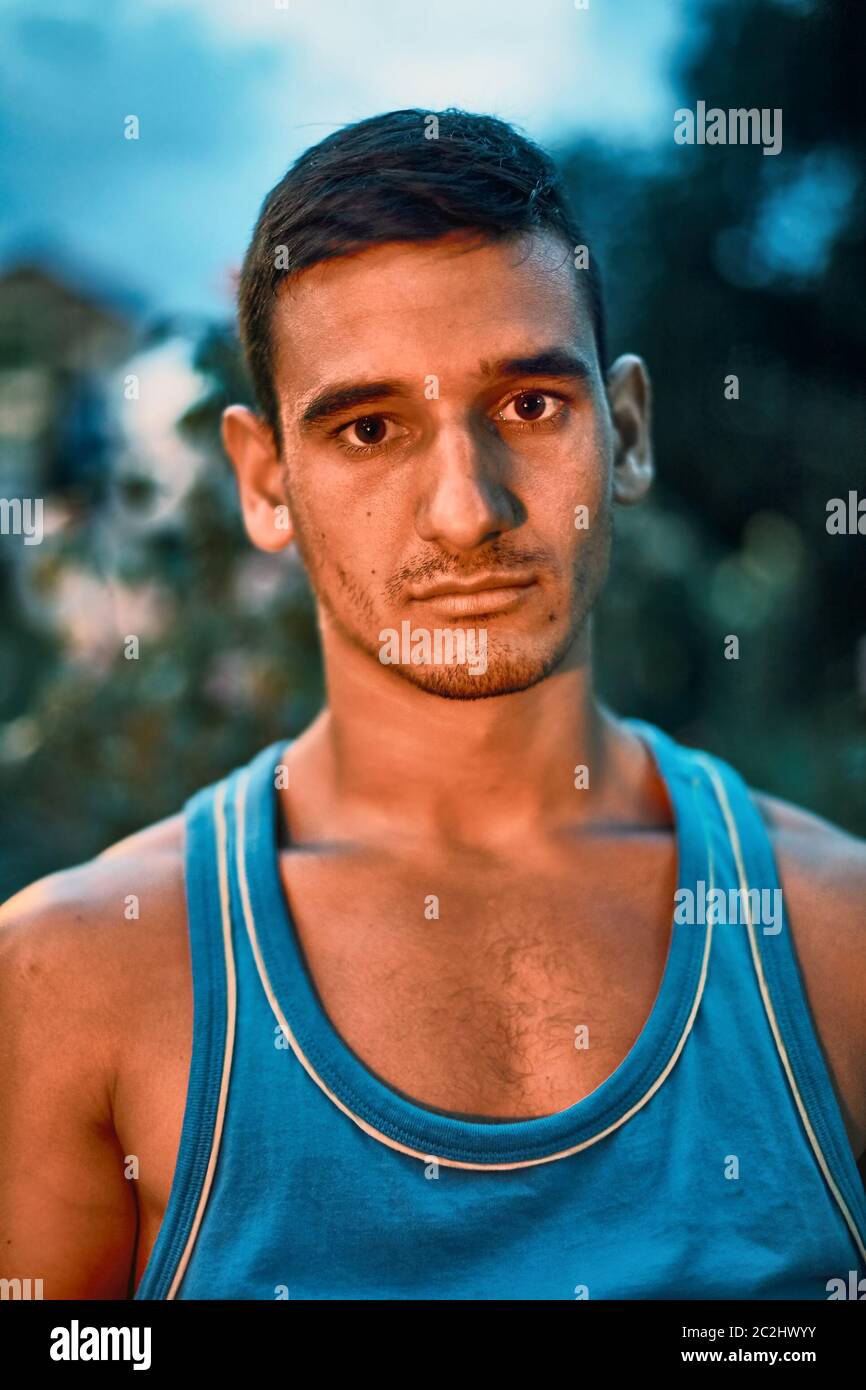 Young man looking strait at the camera, outdoor portrait Stock Photo ...