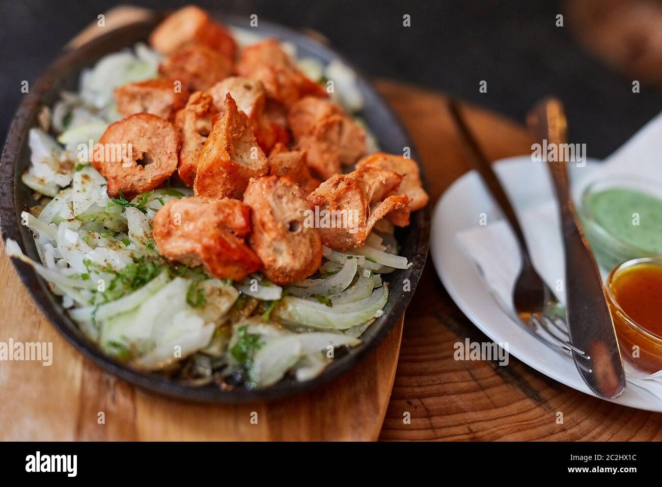 Indian food chicken tikka dish served in a restaurant Stock Photo - Alamy