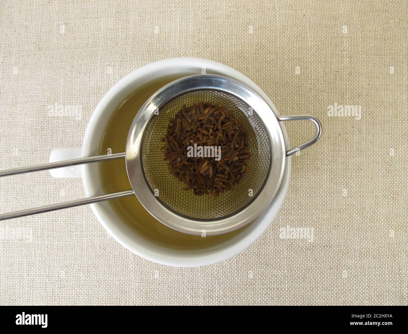 Tea from caraway seeds and caraway fruits in the tea strainer Stock ...